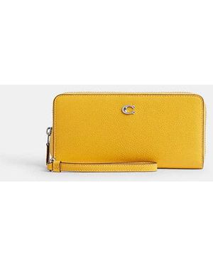 Yellow COACH Wallets and cardholders for Women | Lyst