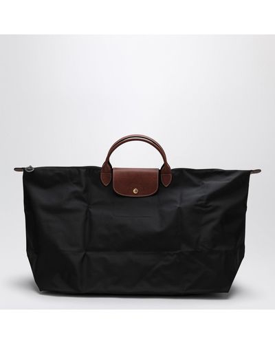Black Longchamp Duffel bags and weekend bags for Women | Lyst