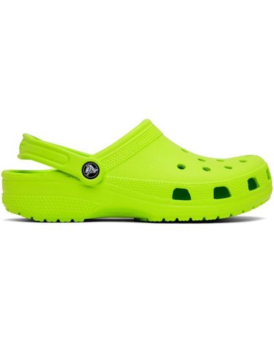 Yellow Crocs™ Sandals, slides and flip flops for Men | Lyst