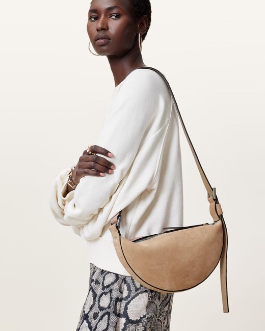 AllSaints Half Moon Suede Crossbody Bag in Natural | Lyst