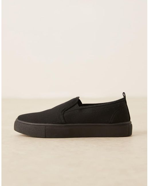 ASOS Dotty Slip On Plimsolls in Black | Lyst UK