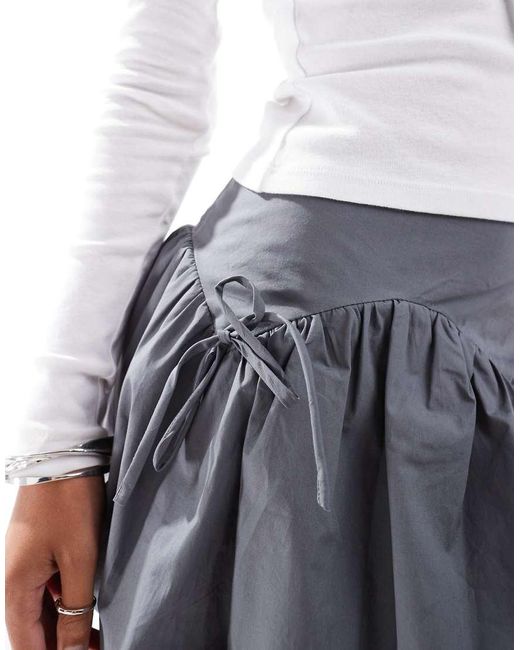 Glamorous Mid Rise Puff Ball Mini Skirt With Bow Detail in Blue | Lyst UK