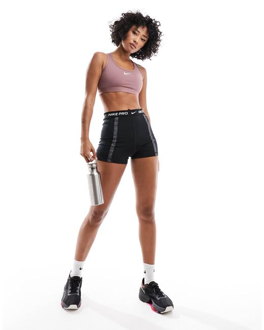 Nike Mini Swoosh Medium Support Sports Bra in Natural | Lyst