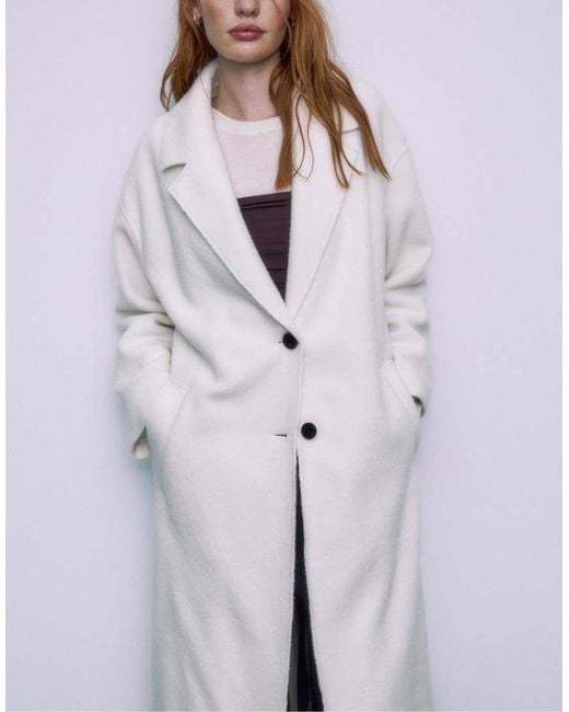 Stradivarius Long Faux Shearling Lined Coat in Blue | Lyst UK