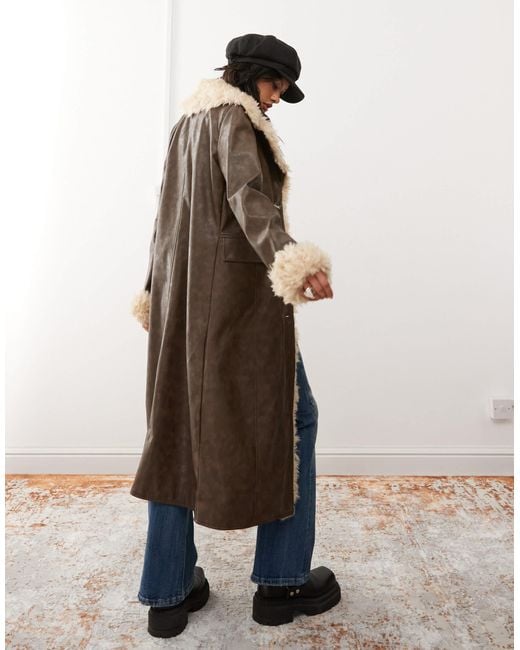 Reclaimed (vintage) Longline Leather Look Coat With Faux Fur Trims in Brown | Lyst