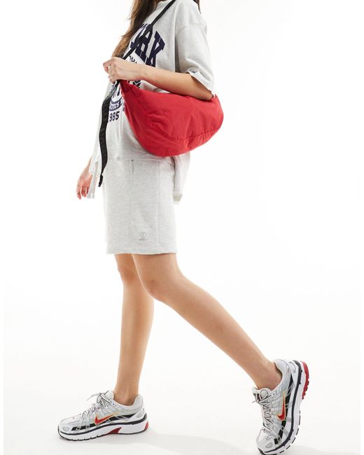 BAGGU Medium Nylon Crescent Crossbody Bag in Red | Lyst UK