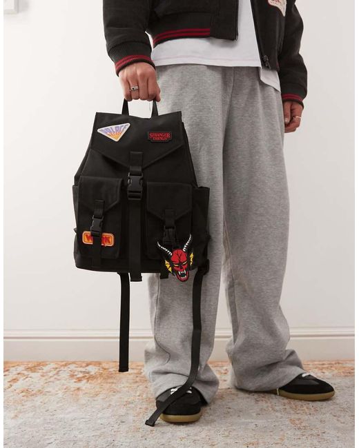 Reclaimed (vintage) X Stranger Things Backpack With Badges in Black ...