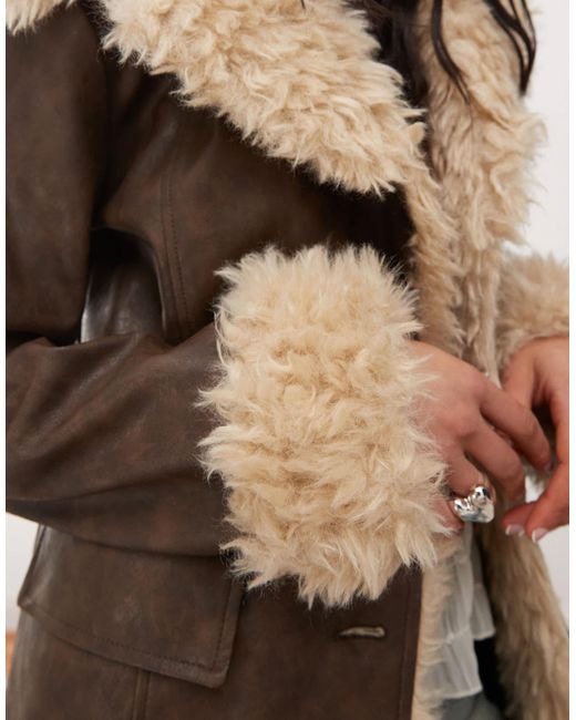 Reclaimed (vintage) Longline Leather Look Coat With Faux Fur Trims in Brown | Lyst