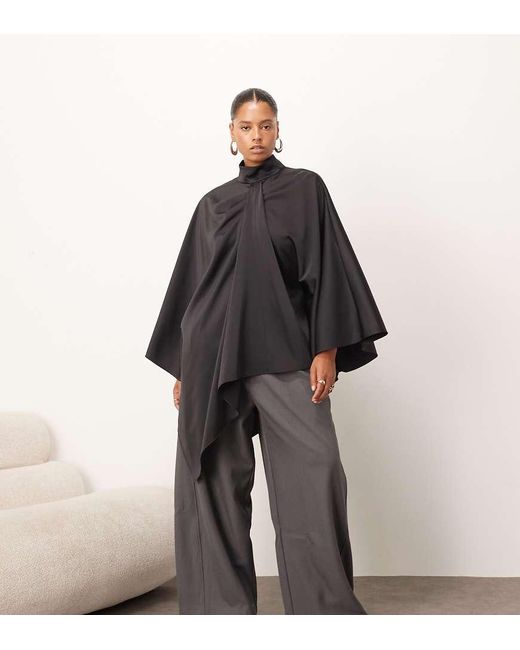 ARRANGE Curve High Neck Drape Cape Top in Black | Lyst UK