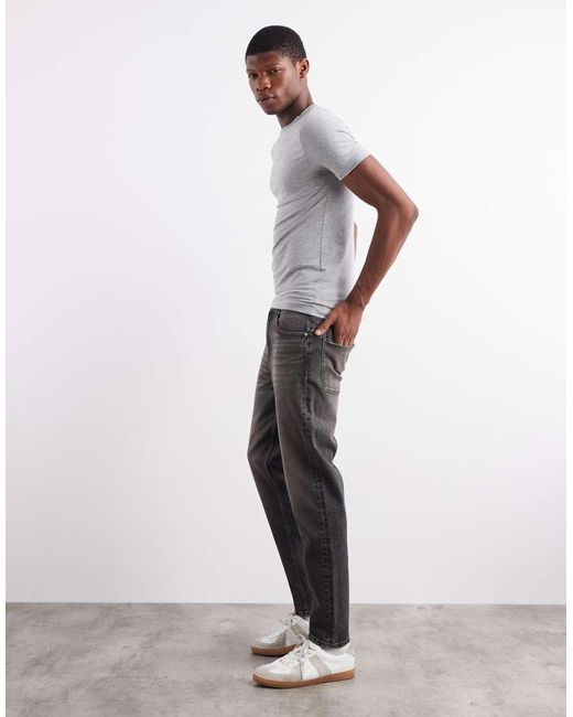ASOS Tapered Fit Jeans With Yellow Tint in White for Men | Lyst UK