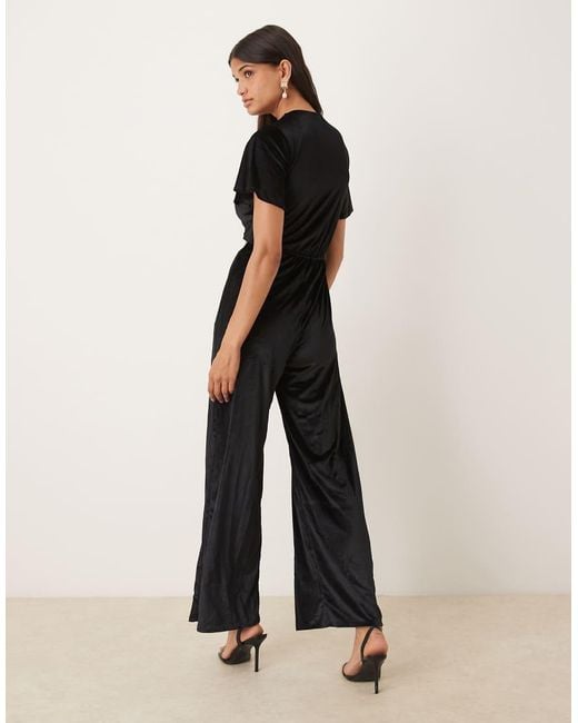 Collective The Label Tie Front Jumpsuit in Black | Lyst UK