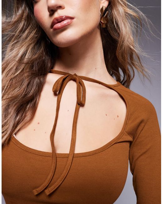 ASOS Ribbed Long Flare Sleeve Tie Neck Maxi Dress in Brown | Lyst