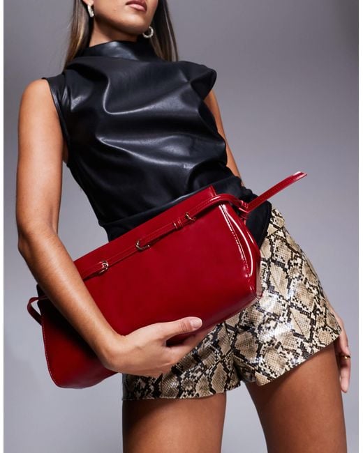 ASOS Clutch Bag With Skinny Buckle Strap Detail in Red | Lyst