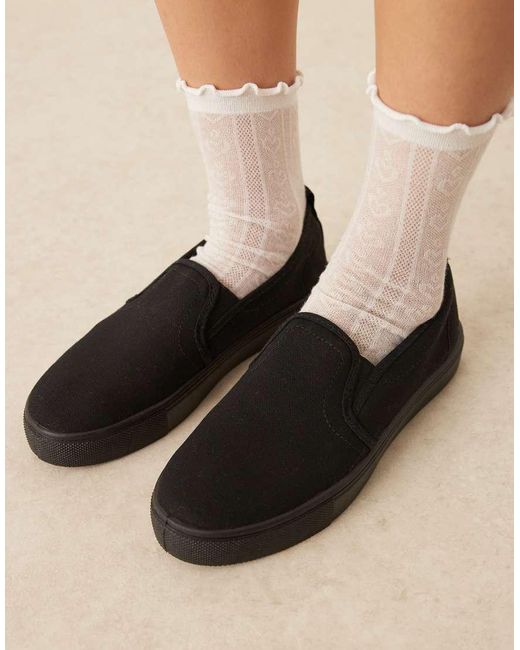 ASOS Dotty Slip On Plimsolls in Black | Lyst UK