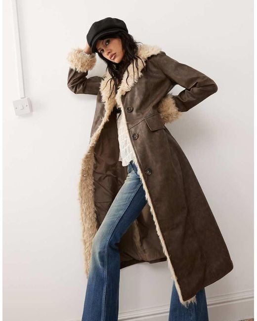 Reclaimed (vintage) Longline Leather Look Coat With Faux Fur Trims in Brown | Lyst UK