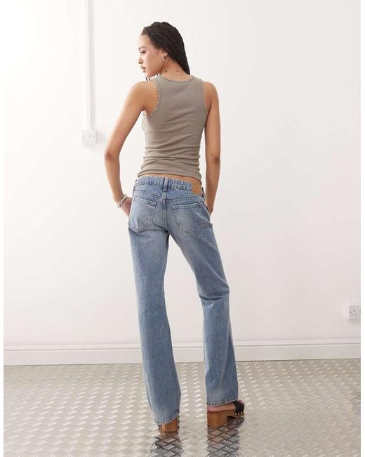 Weekday Low Waist Flare Jeans With Side Button Western Detail in Blue ...