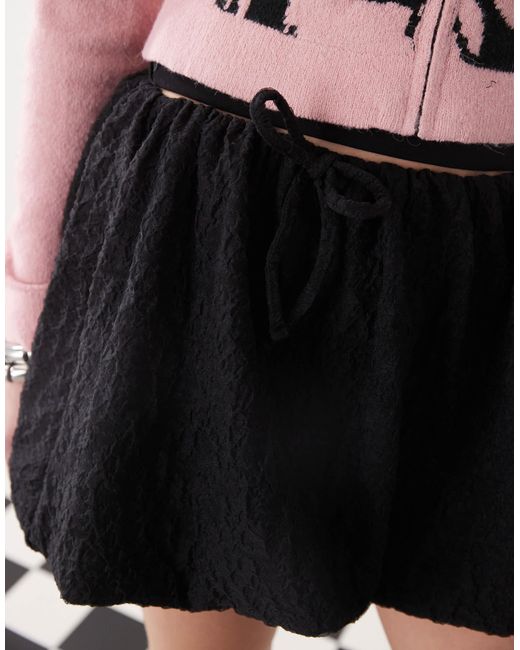 Collusion Mini Puff Ball Textured Skirt With Ties in Pink | Lyst