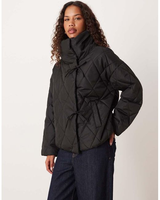 Vila High Neck Quilted Jacket With Tie Details in Black | Lyst UK