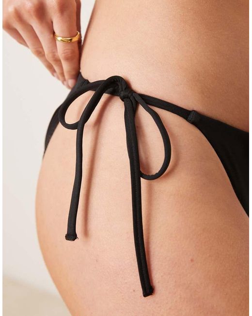 Nike Nike Essential String Bikini Bottom in Black | Lyst UK