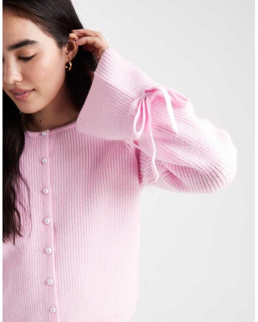 Pieces Knitted Cardigan With Pearl Buttons And Bow Tie Cuffs in Pink ...