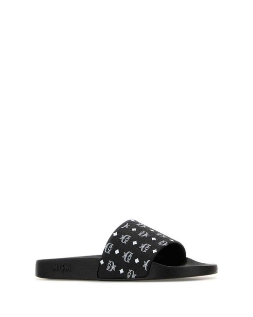 MCM Slippers in Black | Lyst