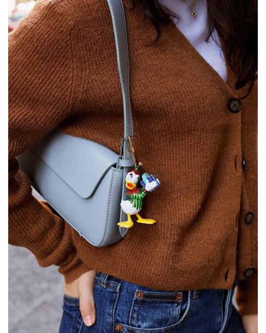 BaubleBar Disney Donald Duck Holiday Gift Bag Charm in Blue | Lyst