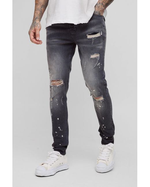 BoohooMAN Tall Skinny All Over Ripped Bleached Paint Splatter Jeans in ...