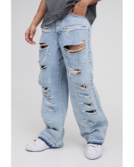 BoohooMAN Wide Leg Skater All Over Ripped Distressed Jeans in Blue for ...