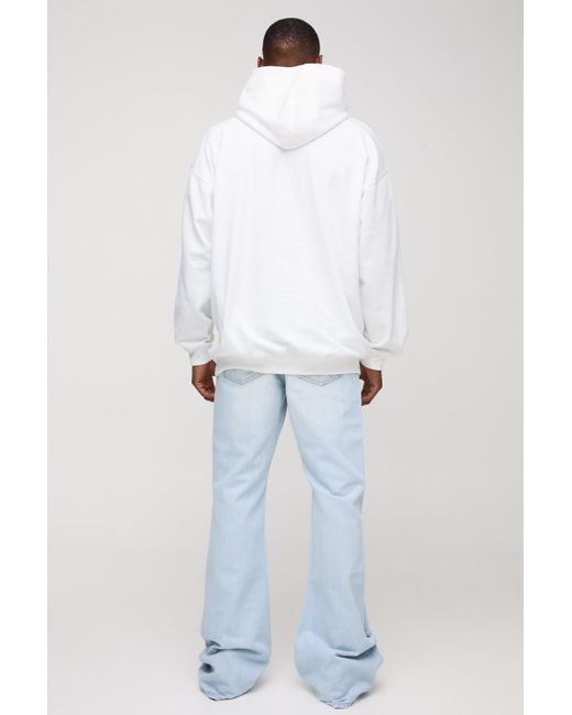 BoohooMAN Relaxed Rigid Flare Stacked Knee Rip Denim Jeans in Blue for ...