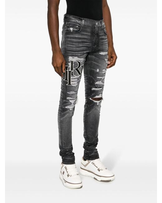 Amiri staggered Skinny Jeans in Grey for Men | Lyst UK
