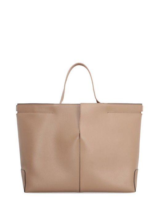 Tod's Slit-Detailed Top Handle Bag in Brown | Lyst