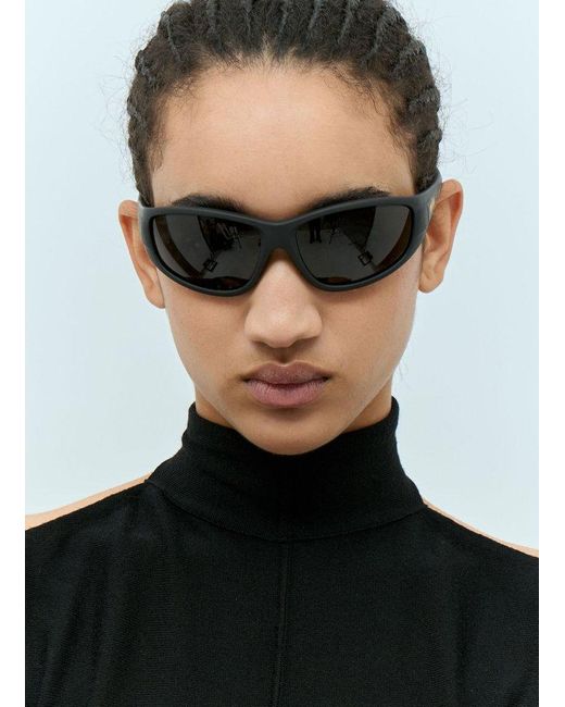 Poppy Lissiman Caidyn Wrap Sunglasses in Black | Lyst