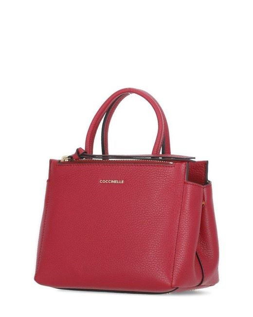 Coccinelle Logo Engraved Small Arlettis Crossbody Bag in Red | Lyst