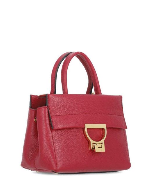 Coccinelle Logo Engraved Small Arlettis Crossbody Bag in Red | Lyst