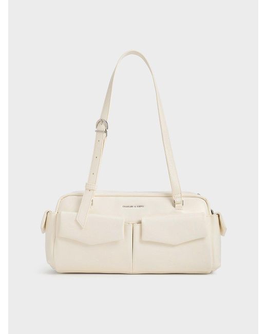 Charles & Keith Rachel Elongated Multi-Pocket Shoulder Bag in Natural ...
