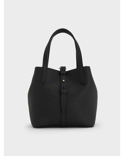 Charles & Keith Beryl Recycled Leather Double-Handle Belted Bucket Bag ...