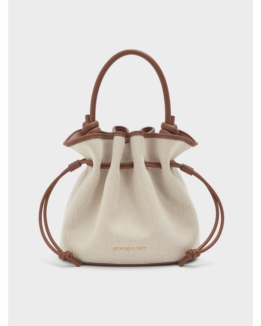 Charles & Keith Sammie Canvas Drawstring Bucket Bag in White | Lyst UK