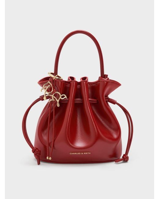 Charles & Keith Sammie Horse-Motif Drawstring Bucket Bag in Red | Lyst UK