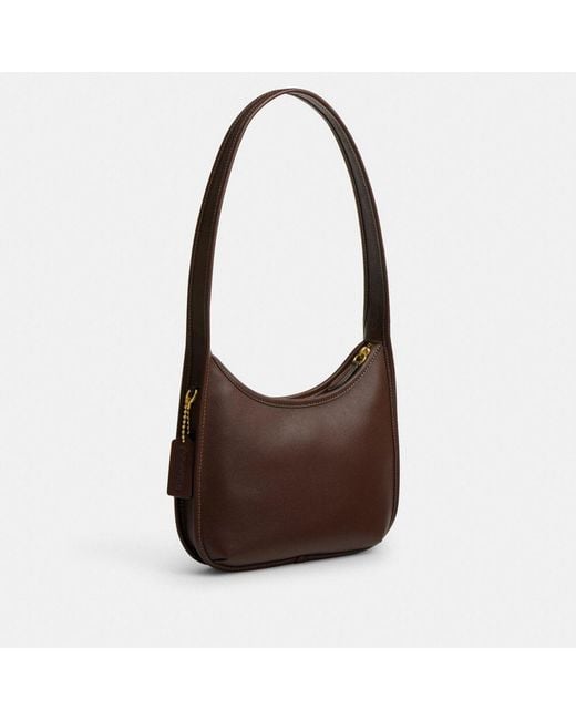 COACH Curve Zip Bag in Brown | Lyst