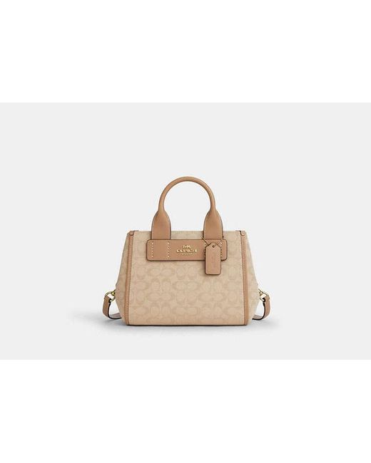 COACH Carly Carryall Bag With Signature Canvas in Black | Lyst UK