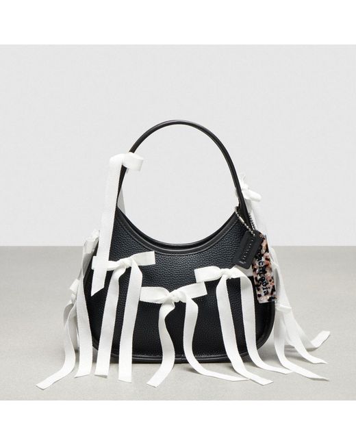 COACH Ergo Bag In Topia Leather With Allover Bows in Black | Lyst
