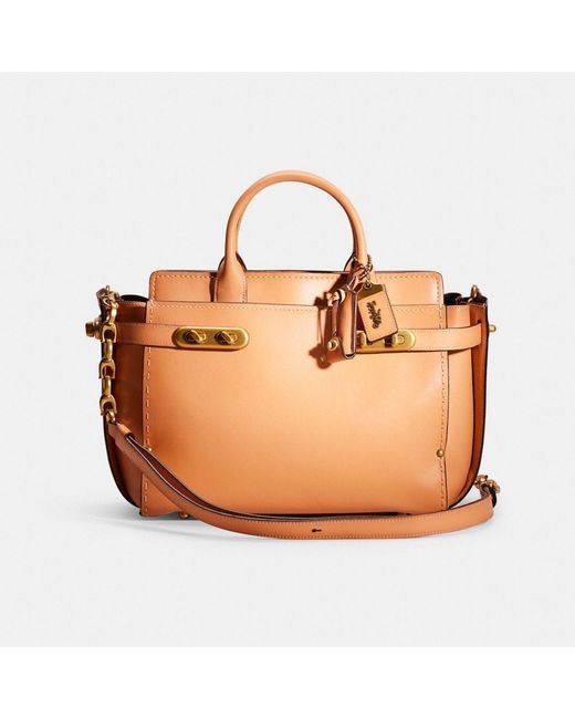 COACH Restored Double Swagger in Orange | Lyst