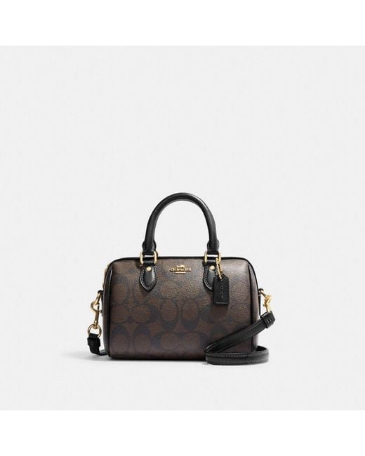 : Mini sac bandoulière Rowan en toile exclusive COACH en coloris Noir ...