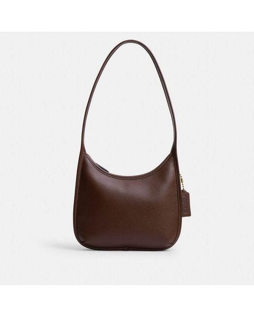 COACH Curve Zip Bag in Brown | Lyst