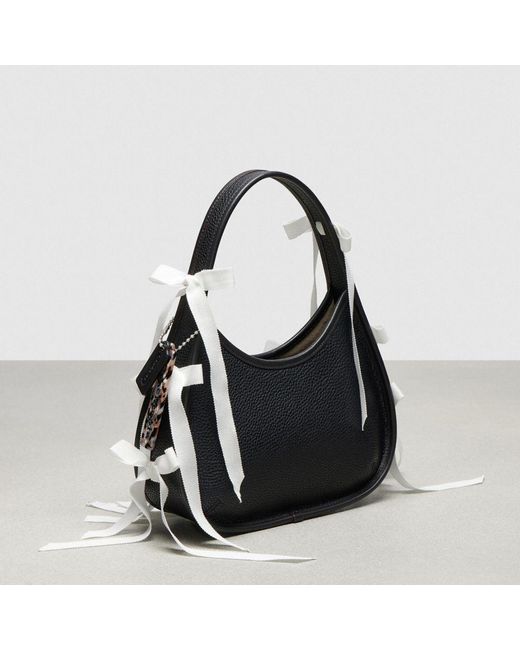 COACH Ergo Bag In Topia Leather With Allover Bows in Black | Lyst
