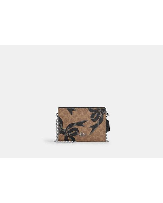 COACH Slim Crossbody Bag In Signature Canvas With Bow Print in Black | Lyst