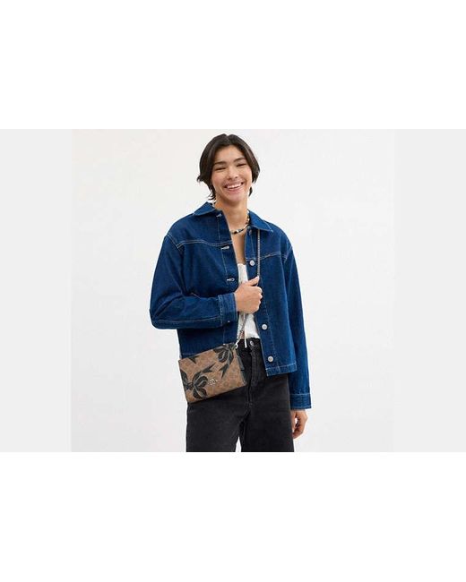 COACH Slim Crossbody Bag In Signature Canvas With Bow Print in Black | Lyst