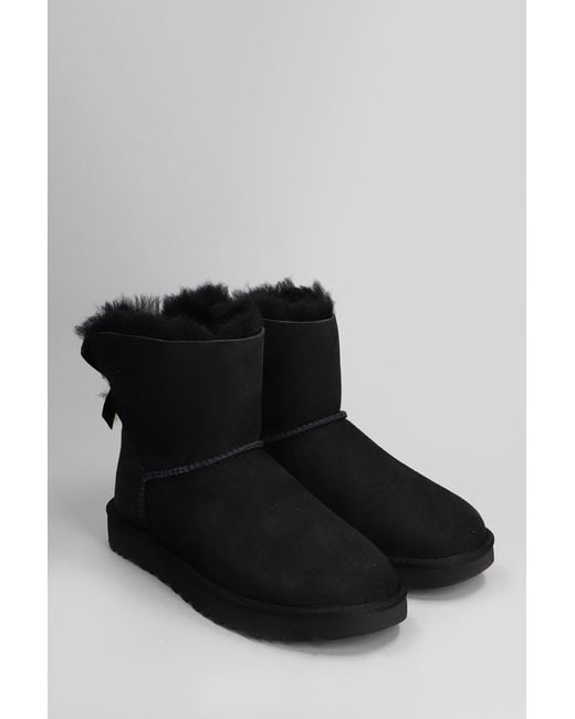 UGG Mini Bailey Bow Ii Low Heels Ankle Boots In Black Suede | Lyst