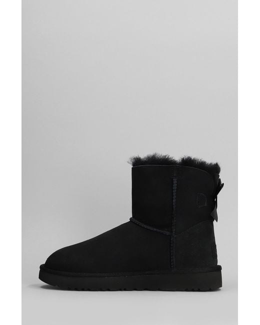 UGG Mini Bailey Bow Ii Low Heels Ankle Boots In Black Suede | Lyst