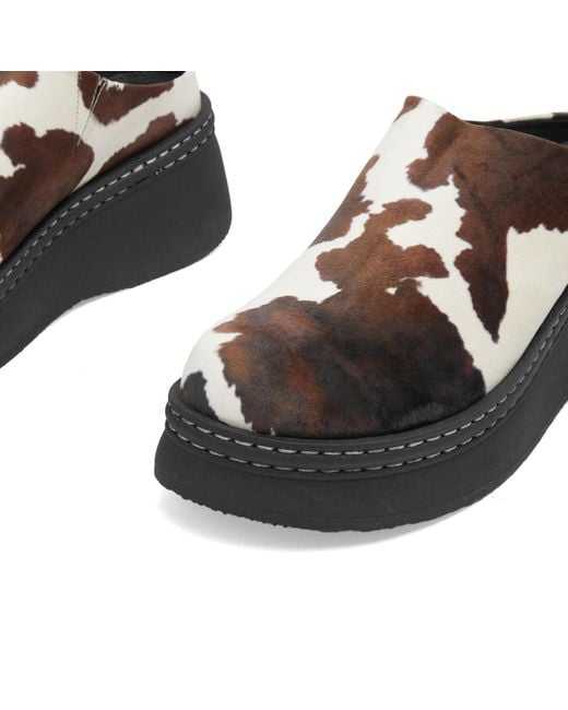 Miista Cow Print Wedge Mules in Brown | Lyst